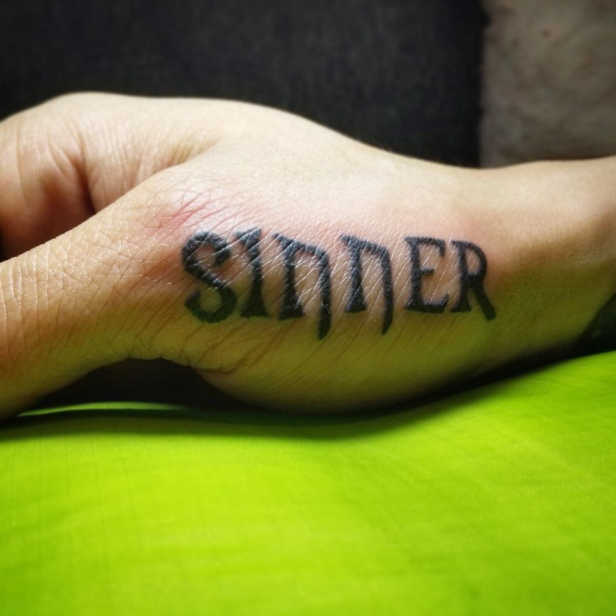 Tattoo uploaded by Tattoos For Humans • "Sinner" on the side of the ...