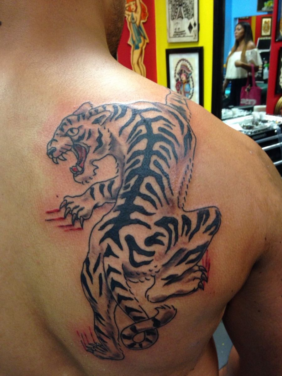 Tattoo uploaded by Jeremiah Camacho • Tiger clawing back #backtattoo # ...