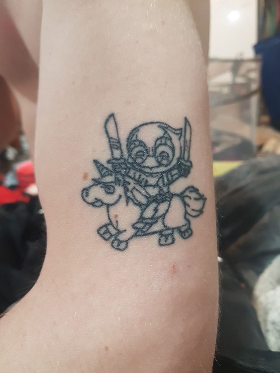 Tattoo uploaded by Seth Laub • Deadpool on a unicorn cartoon • Tattoodo