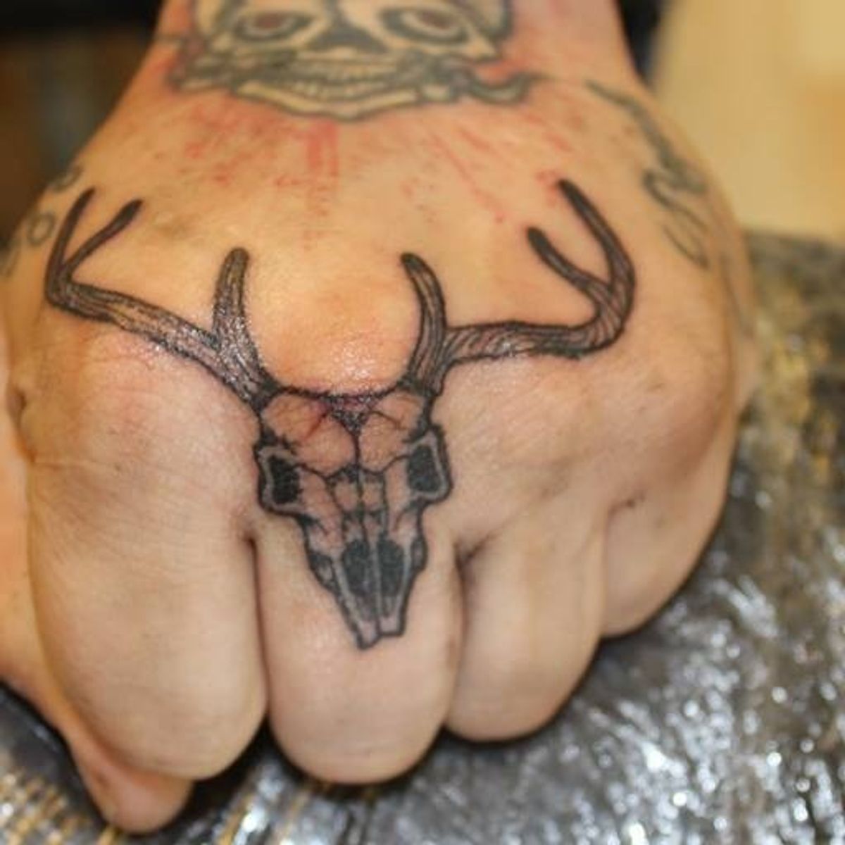 Tattoo uploaded by Rich Ainsworth • skull, antlers, hand tattoo ...
