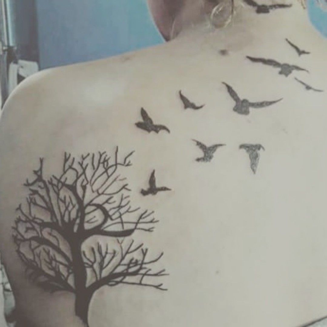 Birds Flying Away From Tree Tattoo