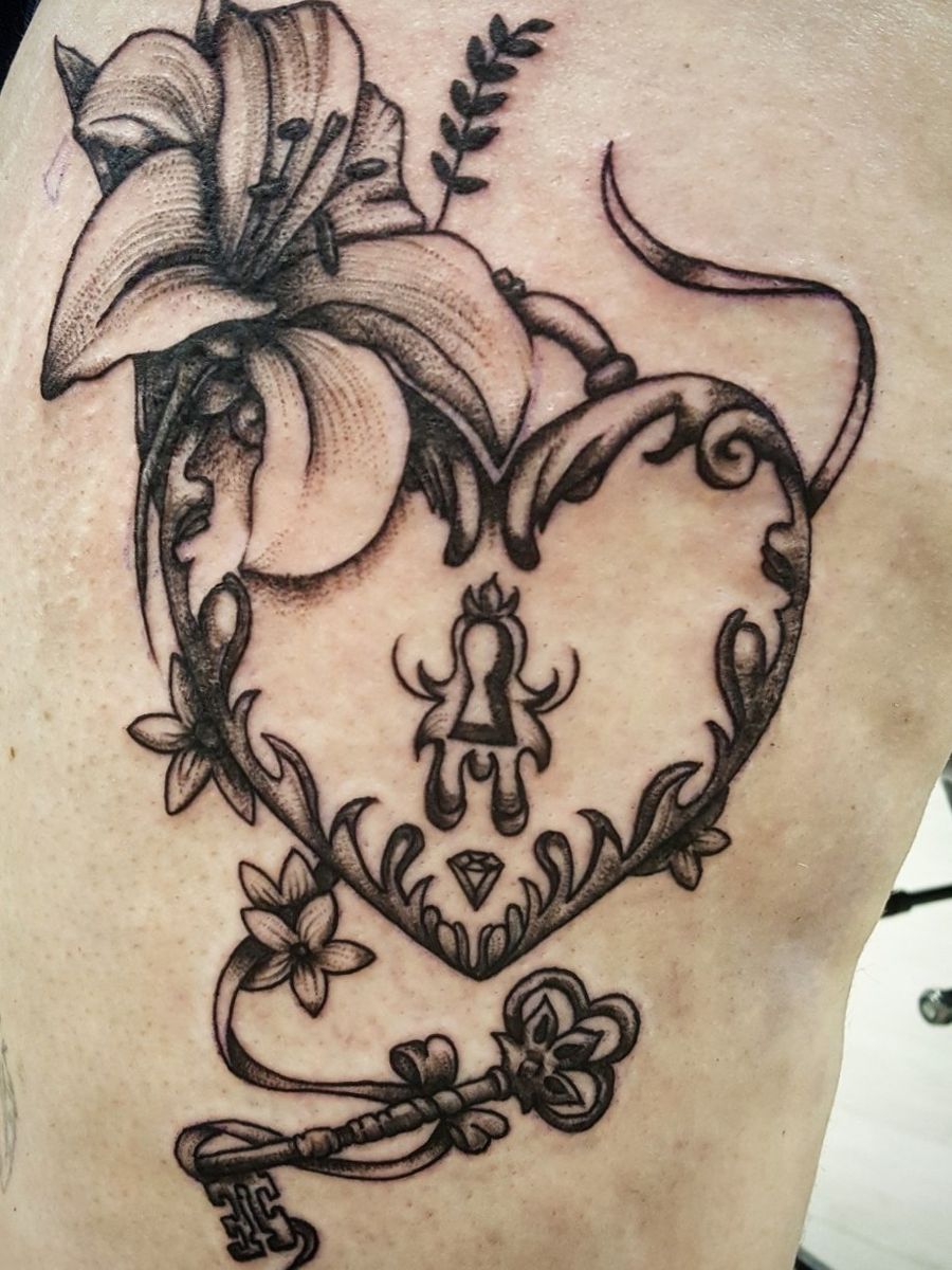 Tattoo uploaded by Ink Imaginarium • Heart locket and lily • Tattoodo