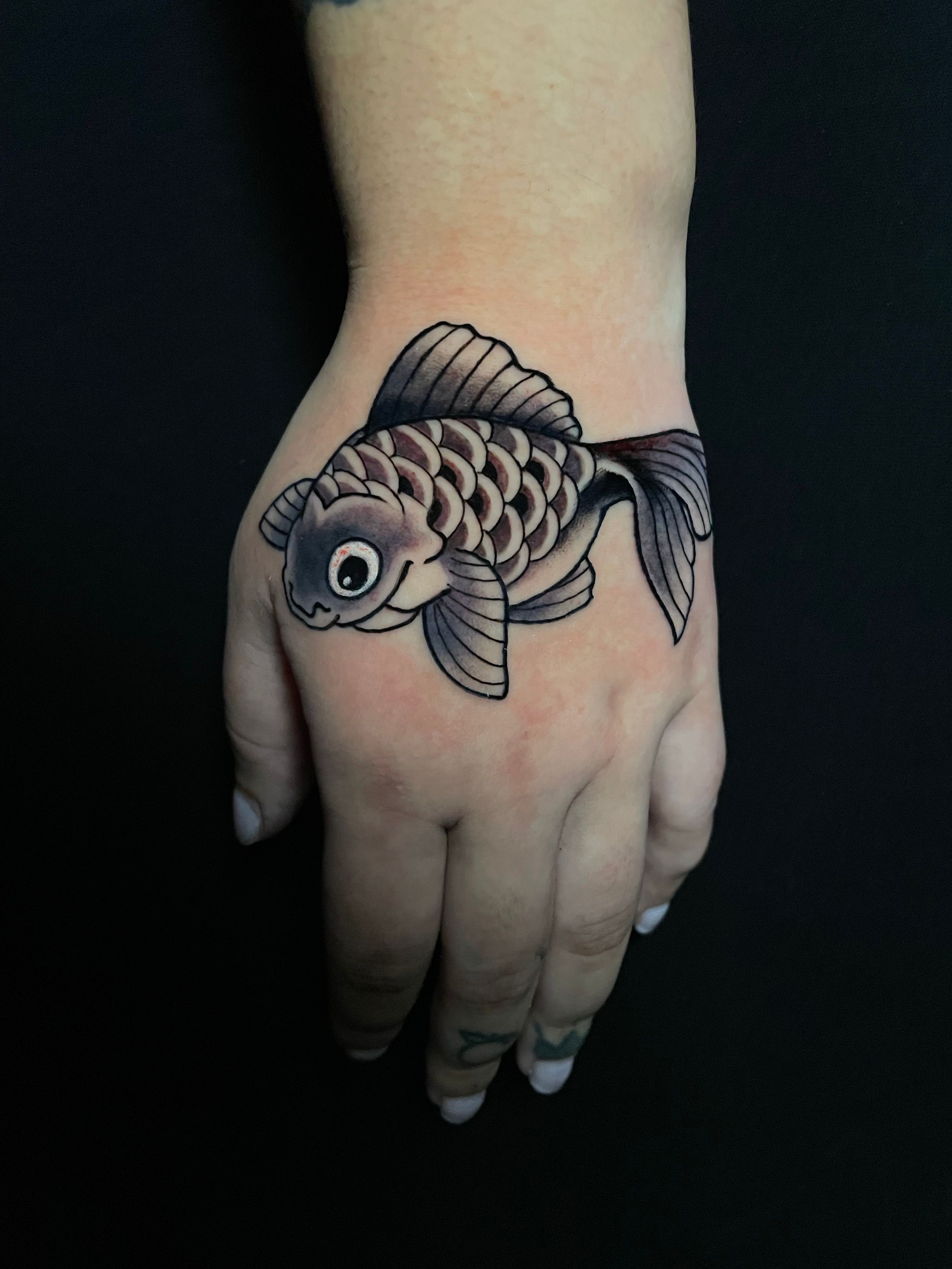 Japanese Blackwork Fish Hand Tattoo • Tattoodo