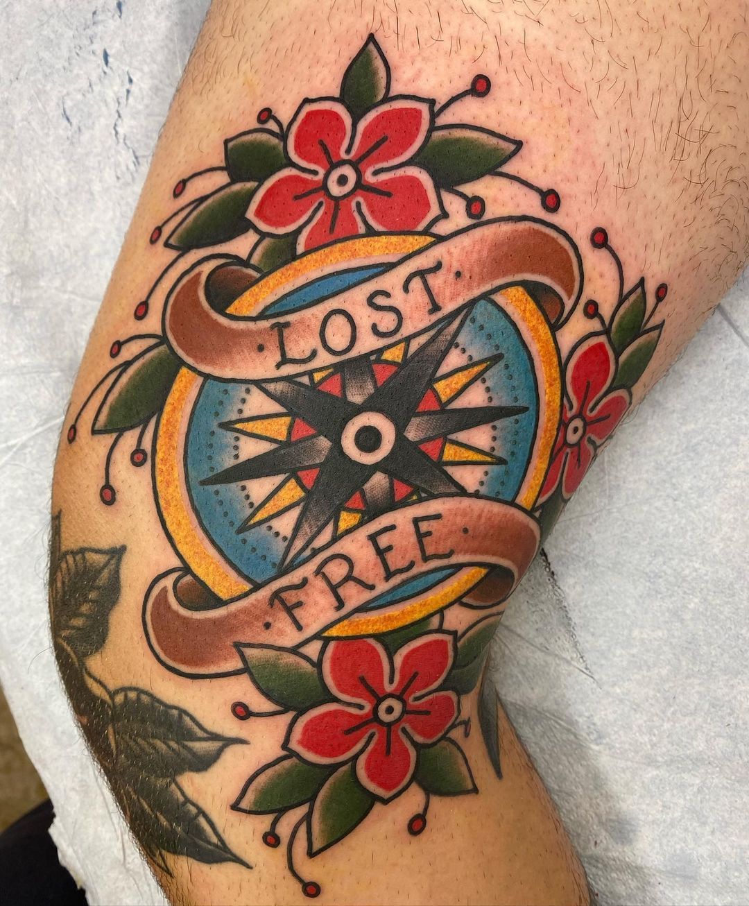 Traditional Flower and Compass Knee Tattoo • Tattoodo