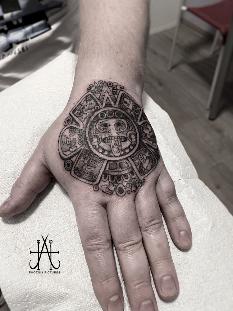 Aztec calendar hand tattoo | Orangetattooshop.com