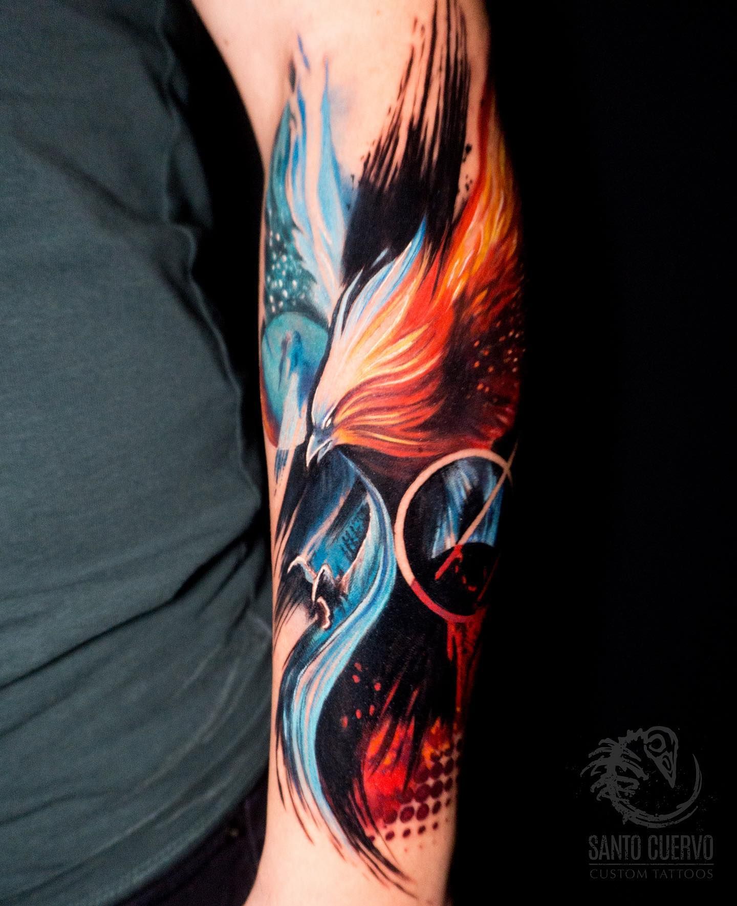 Vibrant Phoenix Forearm Tattoo • Tattoodo