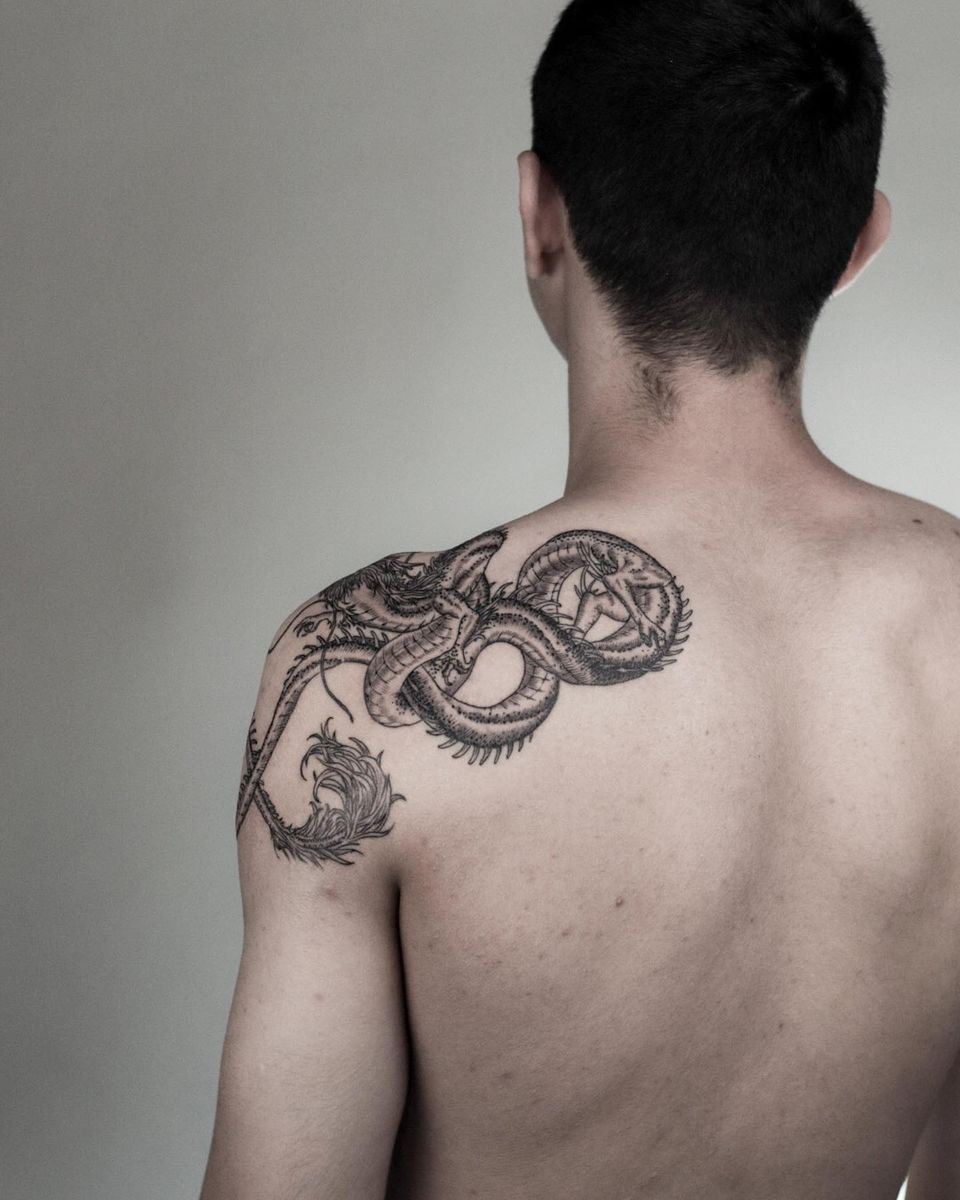 Tattoo uploaded by A Touch Of Ink • Tatuaj alb-negru cu dragon pe umăr ...