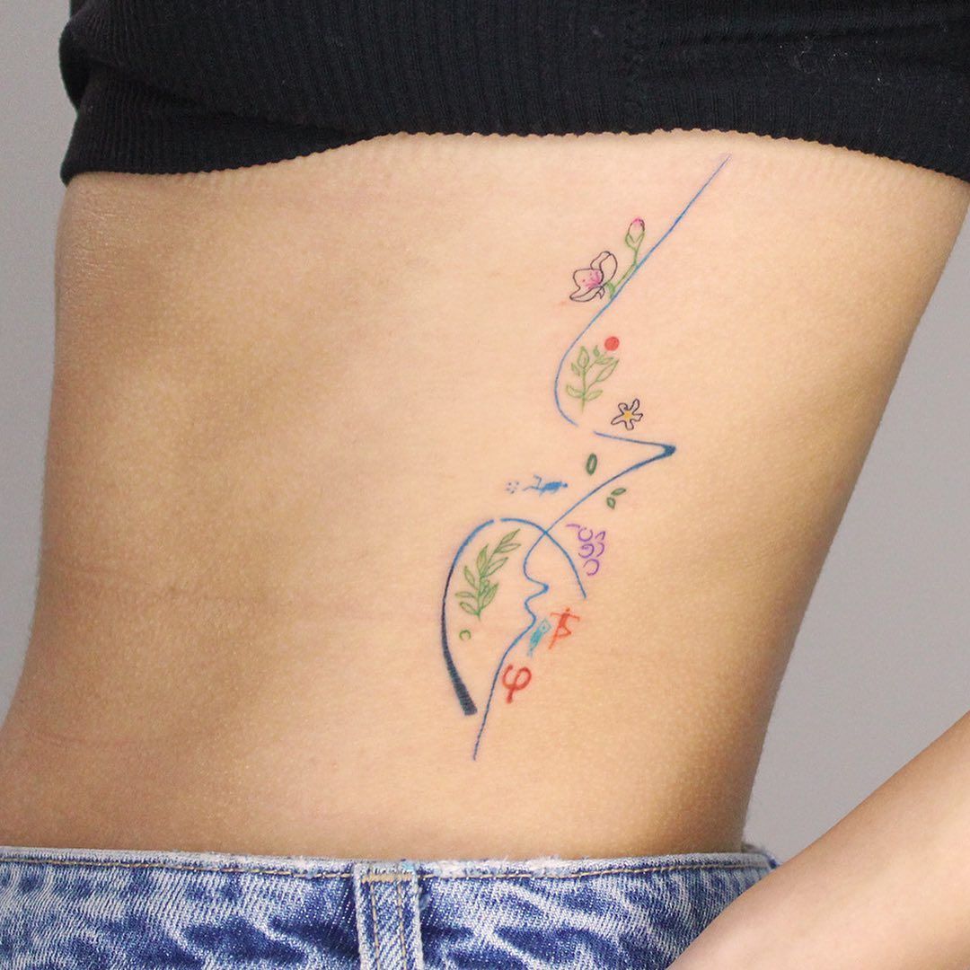 Delicate butterfly and flower ribs tattoo • Tattoodo