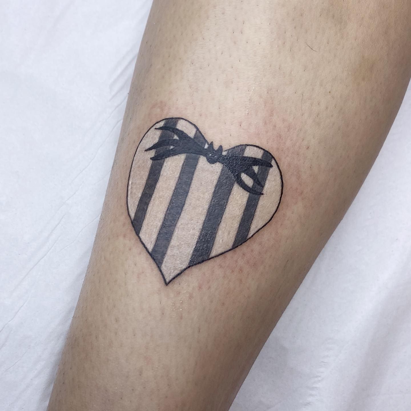 Illustrative Bat and Heart Forearm Tattoo • Tattoodo