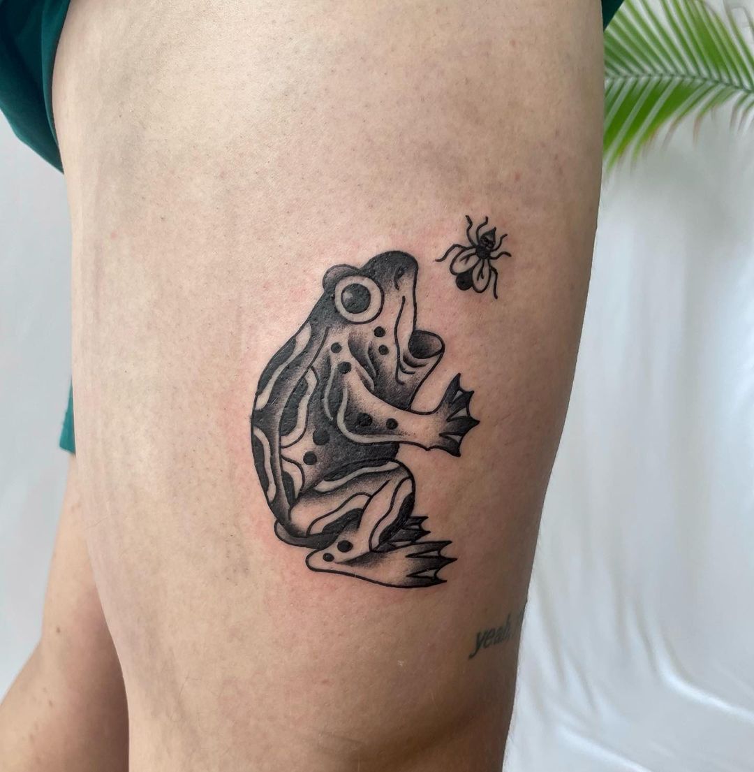 Blackwork Frog and Fly Tattoo on Upper Leg • Tattoodo