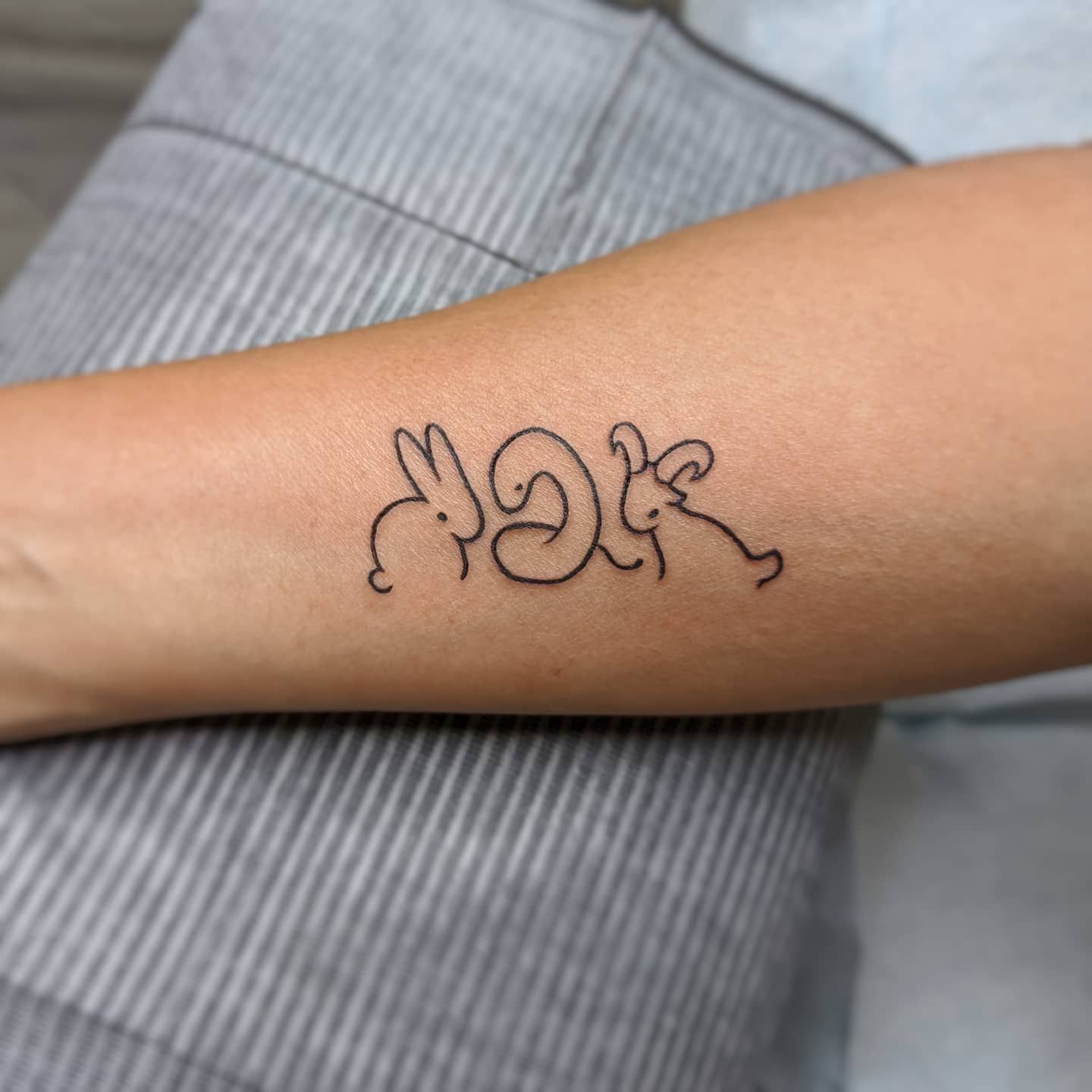 Rabbit and Snake Forearm Tattoo • Tattoodo