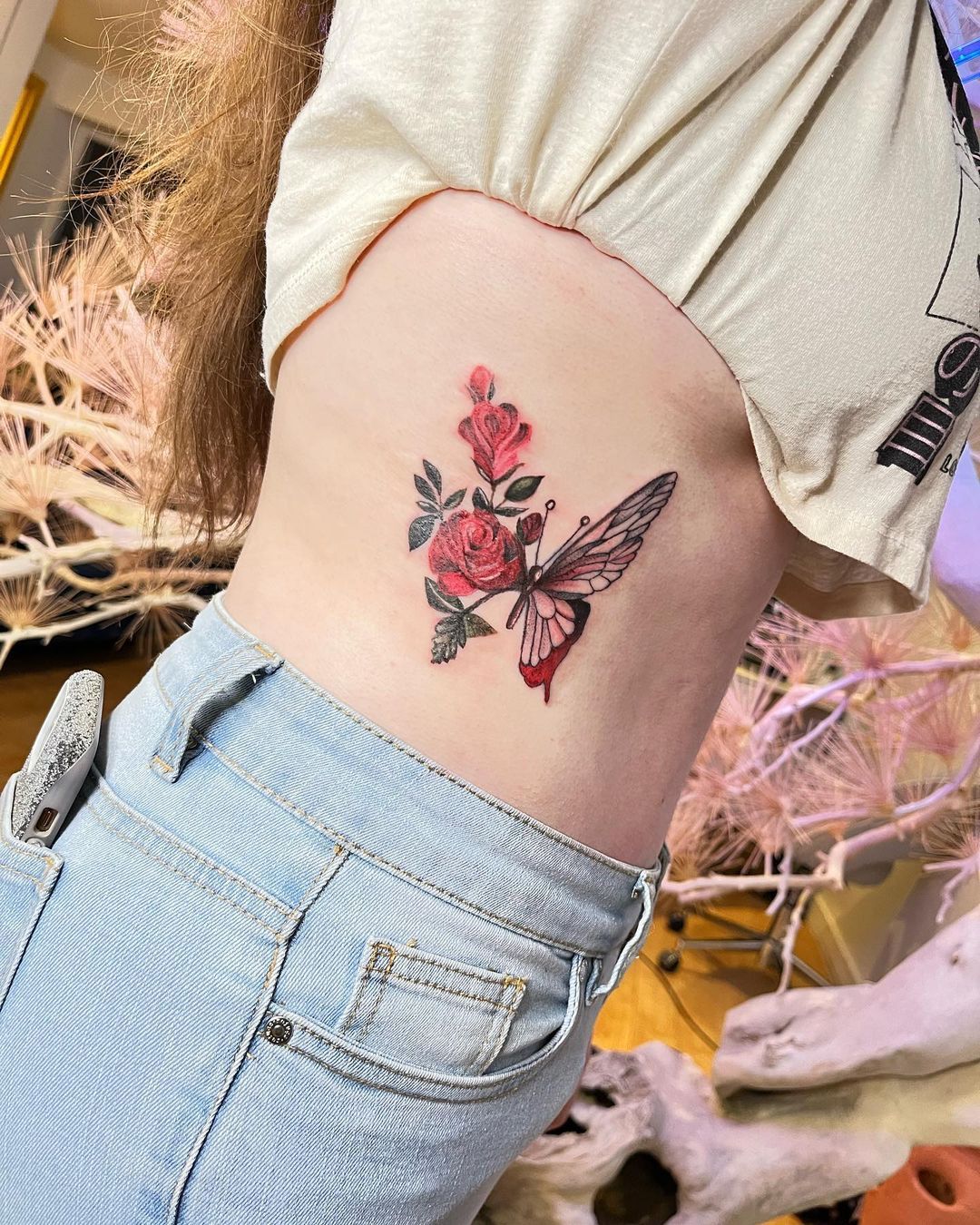 Illustrative Butterfly and Flower Rib Tattoo • Tattoodo