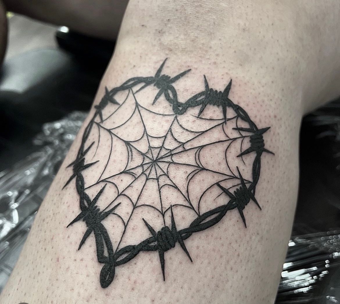Blackwork heart with barbed wire and spider web • Tattoodo