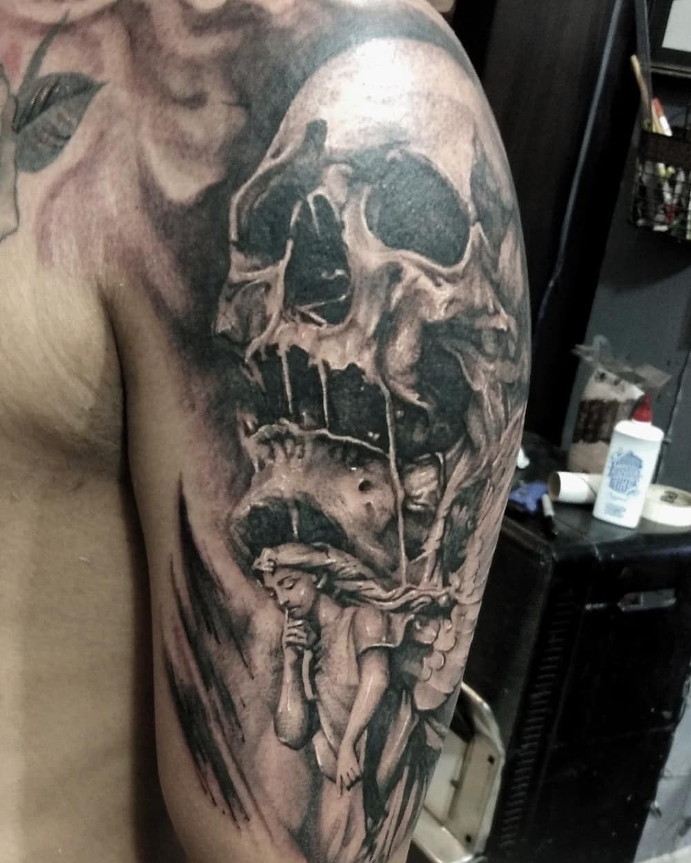 Skull Upper Arm Tattoo by Avi • Tattoodo