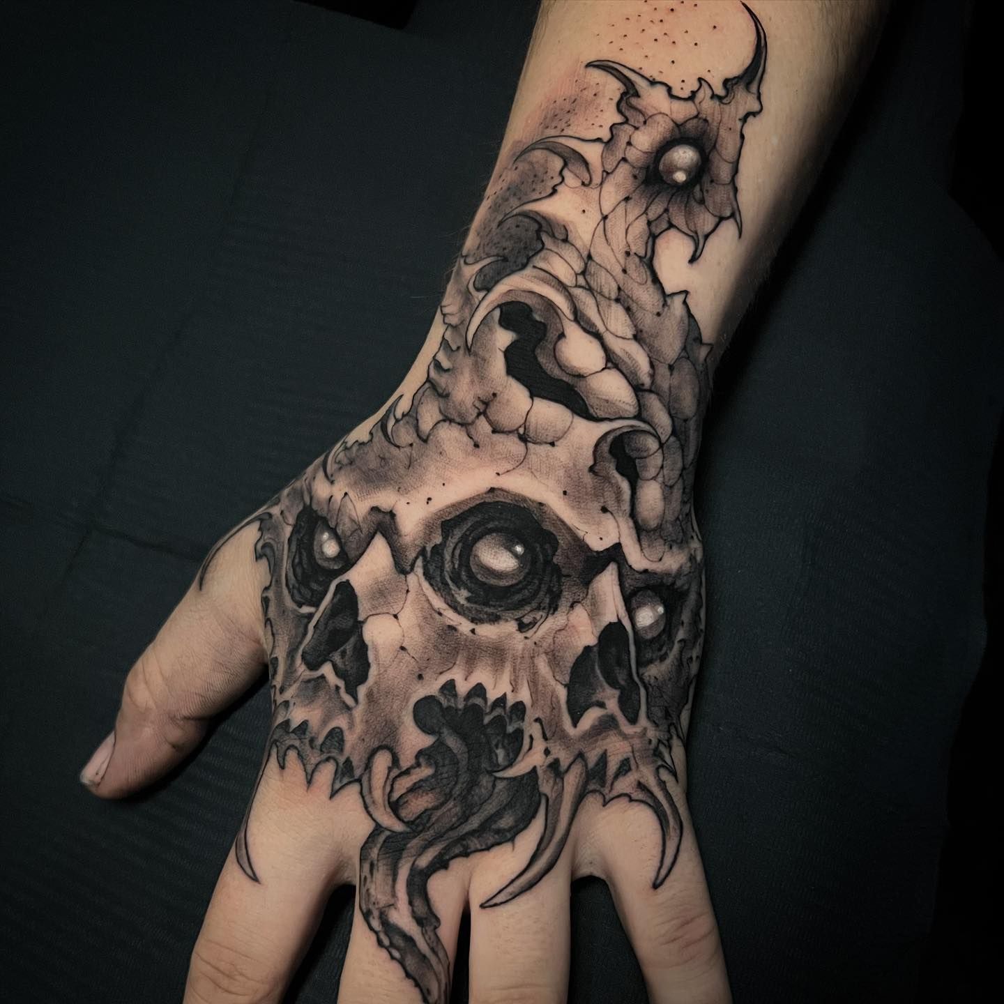 Skull Hand Tattoo Designs