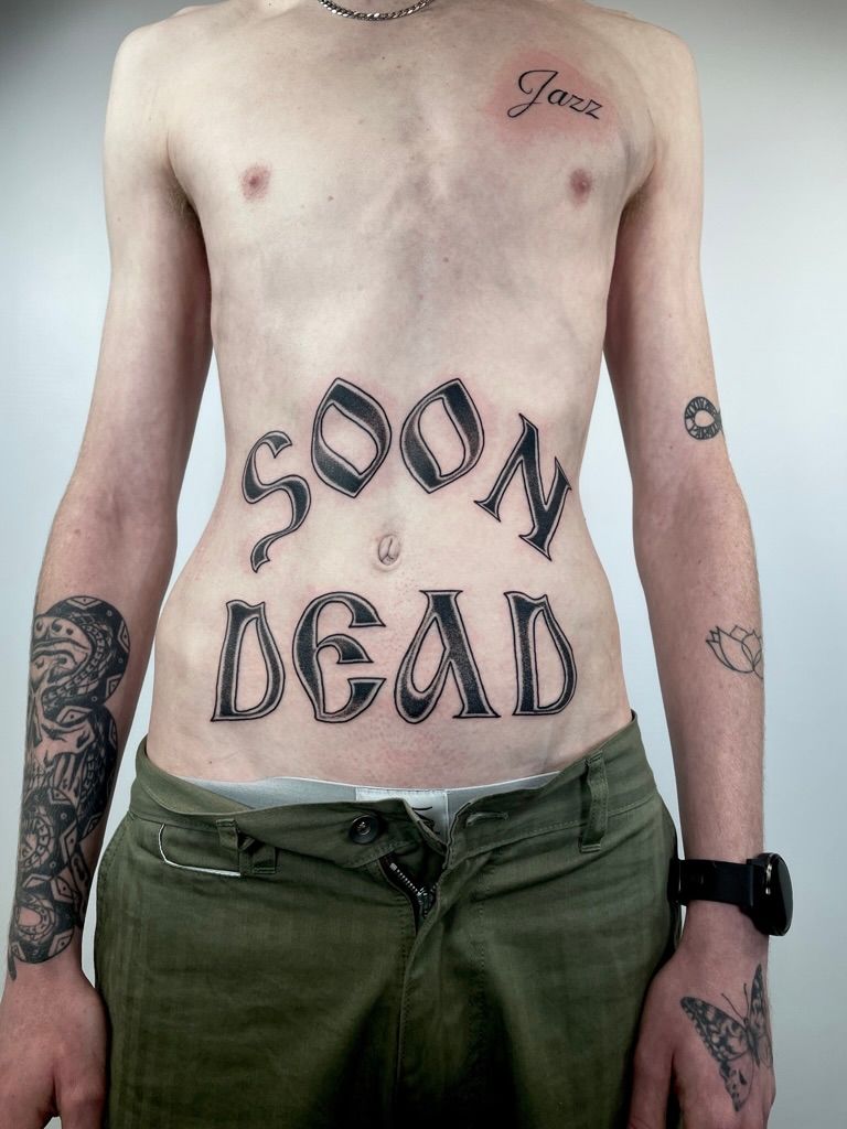 Elegant Script Stomach Tattoo • Tattoodo