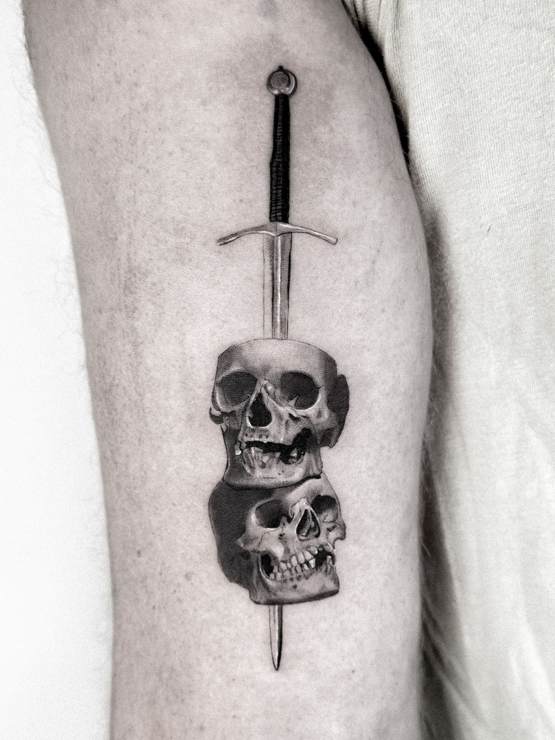 Sword Through Skulls • Tattoodo
