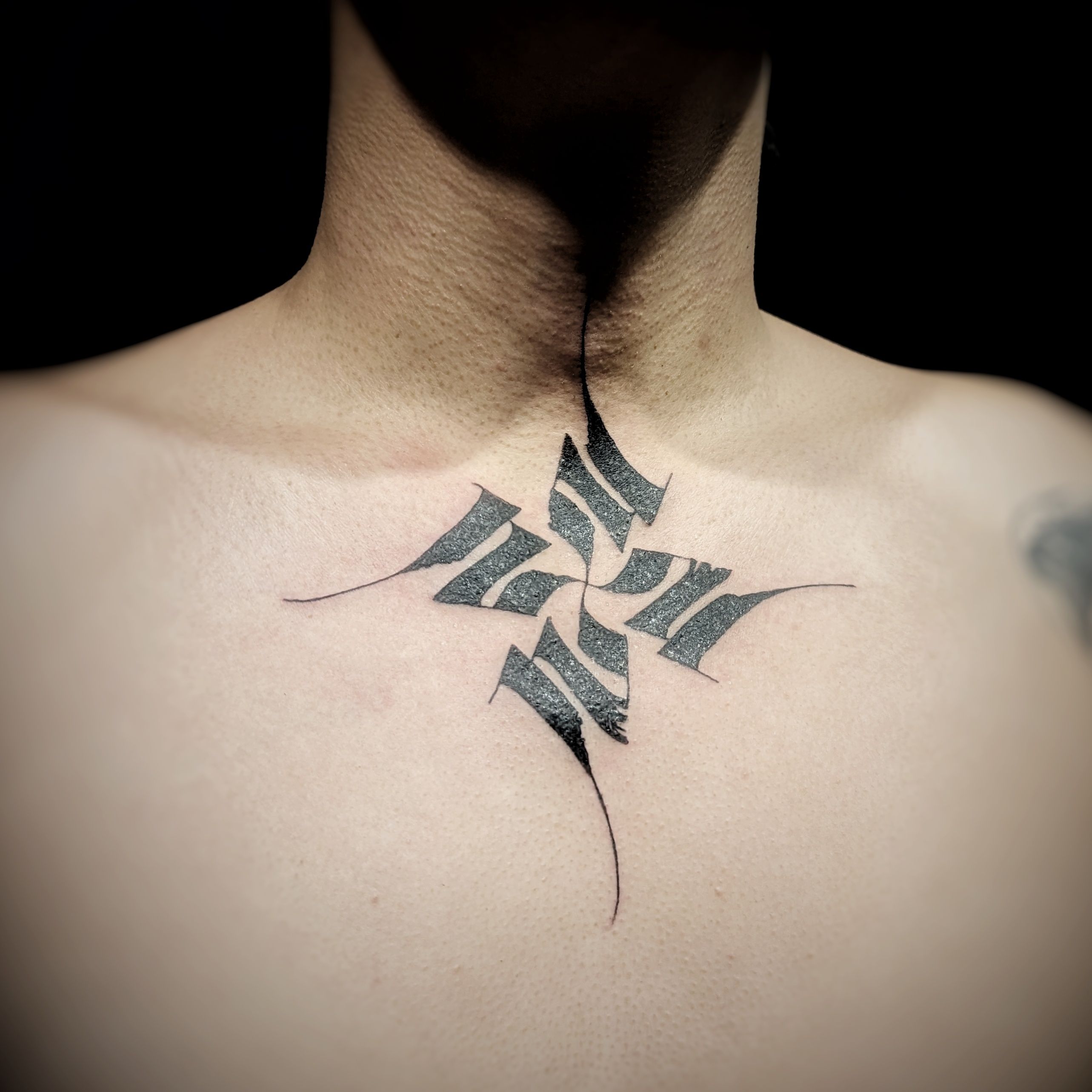 Intricate lettering chest tattoo by Chun Lee • Tattoodo