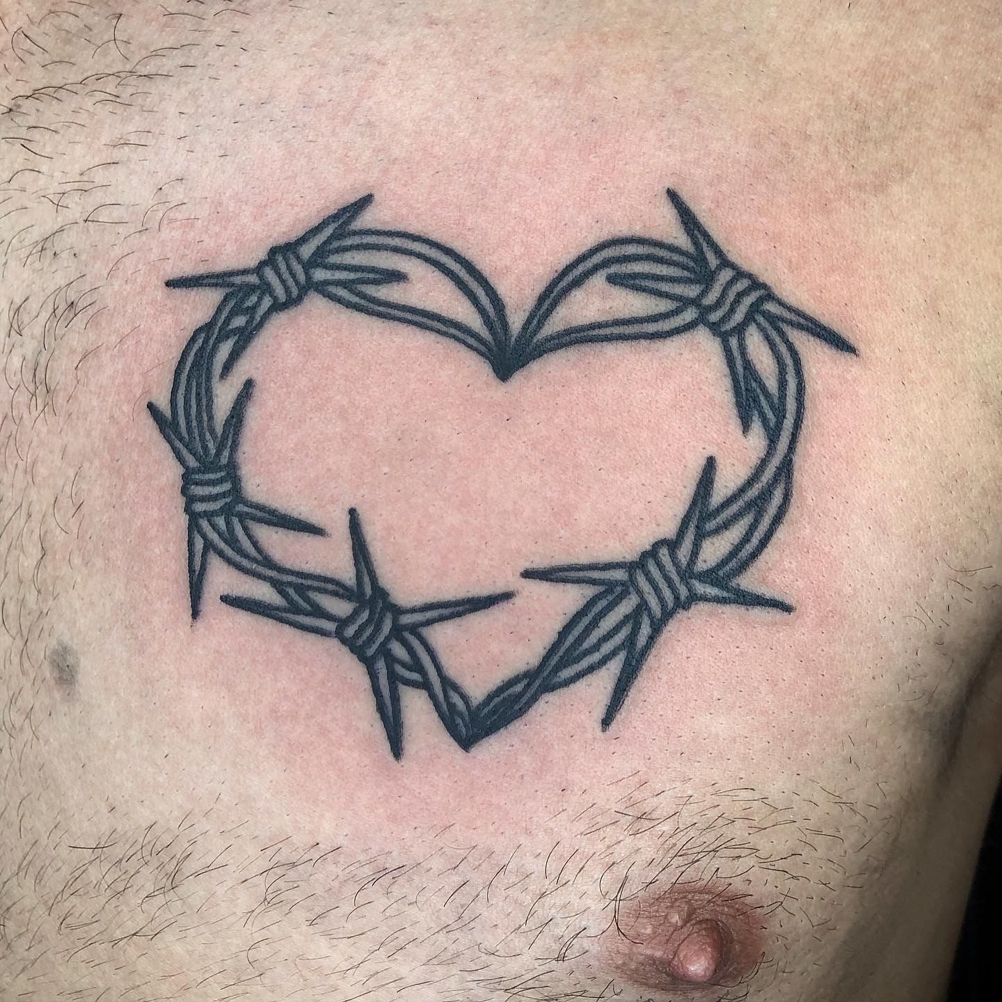Traditional Heart and Barbed Wire Chest Tattoo • Tattoodo