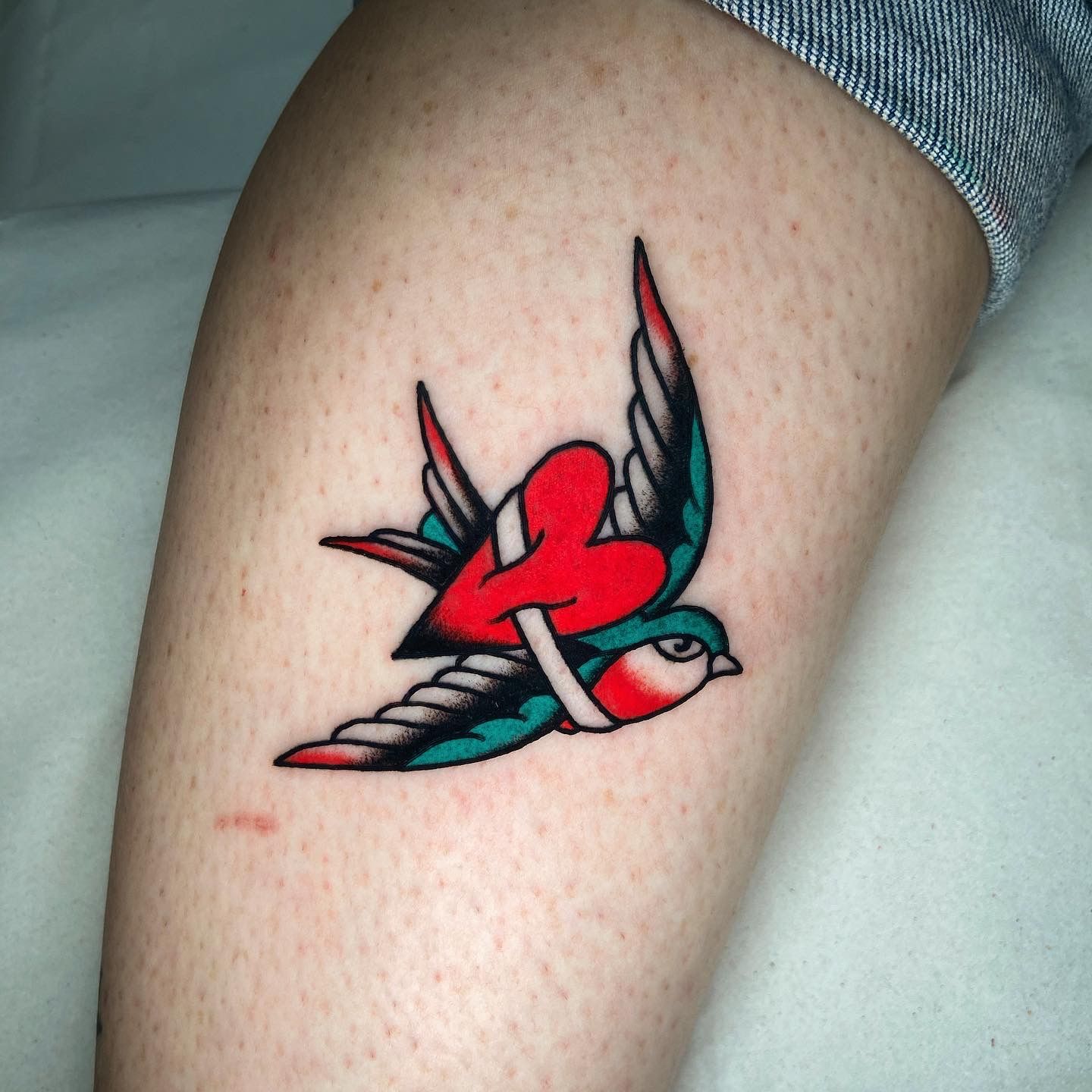 Traditional Bird and Heart Leg Tattoo • Tattoodo