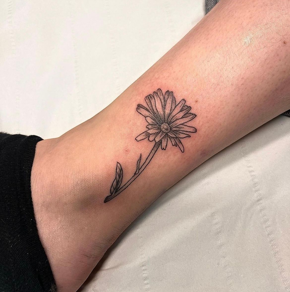Fine Line Floral Lower Leg Tattoo • Tattoodo