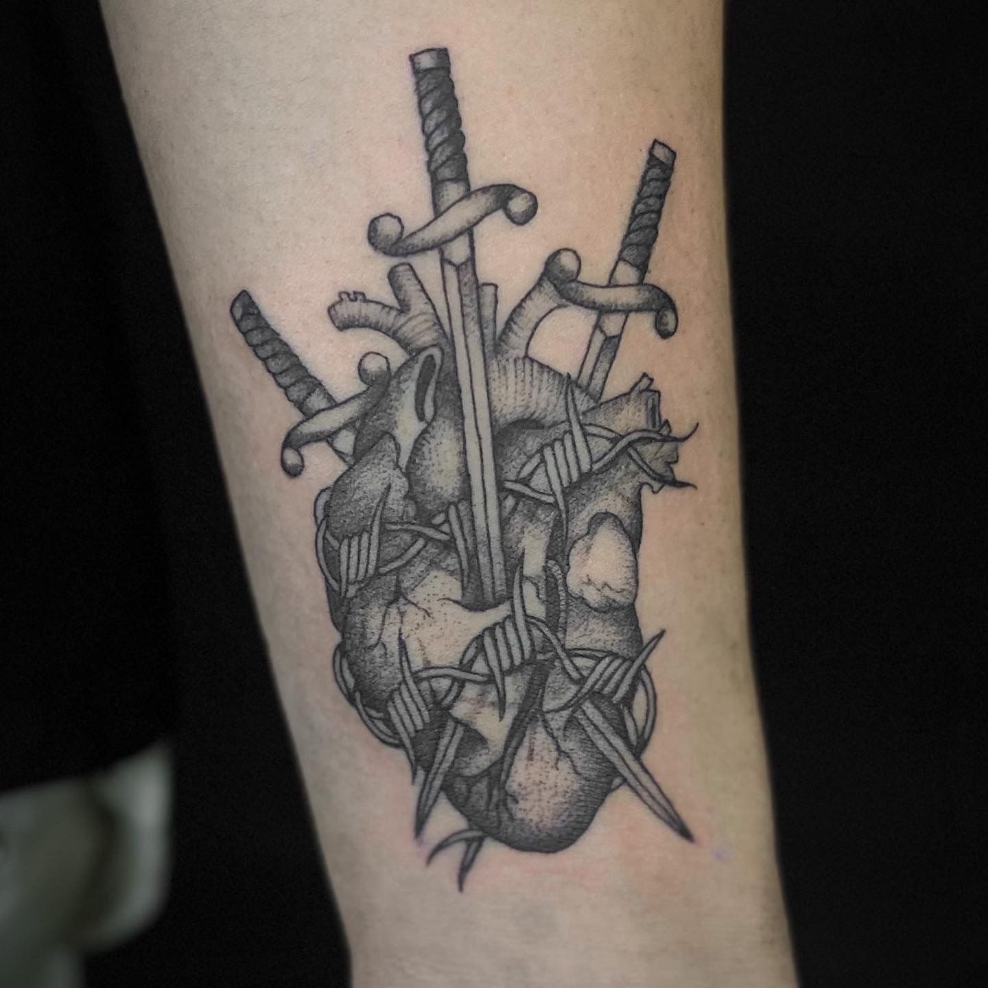 Heart with Swords and Barbed Wire • Tattoodo