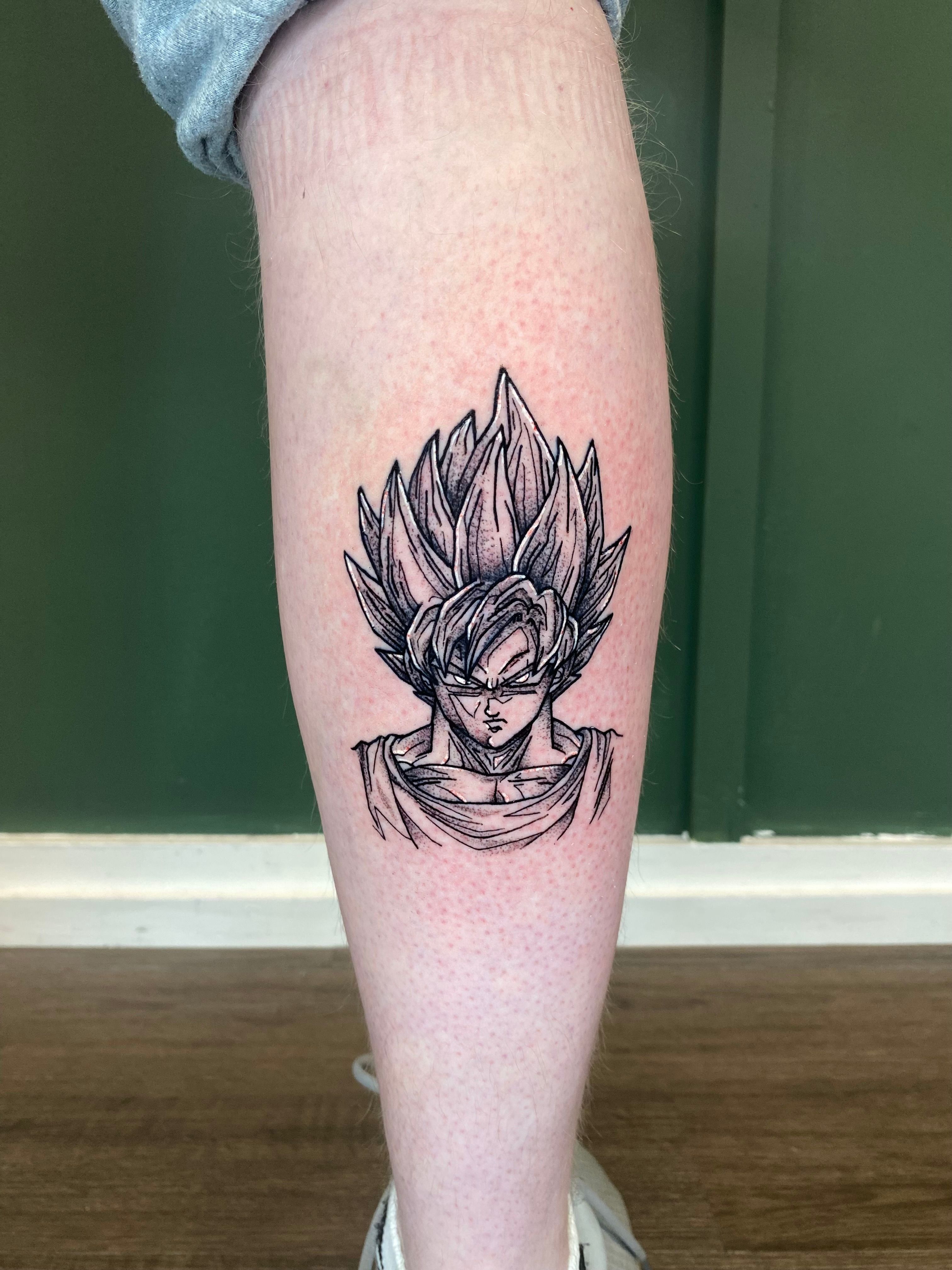 Goku Anime Tattoo on Lower Leg • Tattoodo