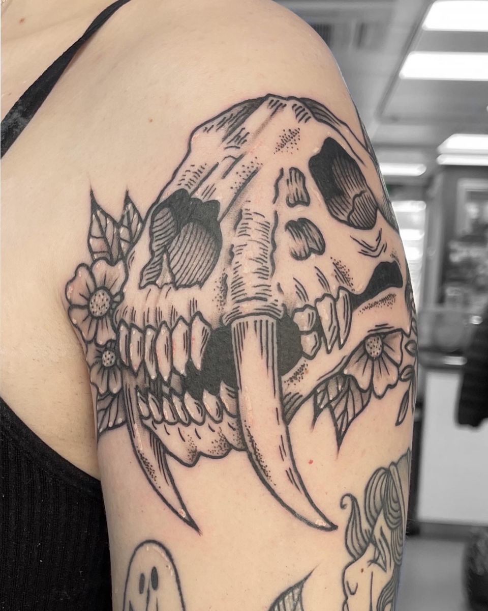 Tattoo uploaded by Emily Webster • Saber Toothed Tiger Skull • Tattoodo
