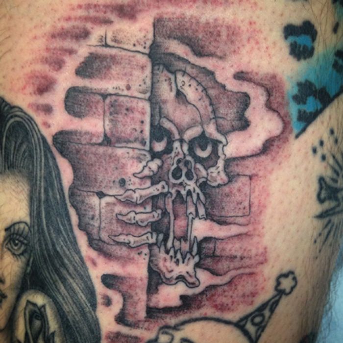 Skull Breaking Through Wall • Tattoodo