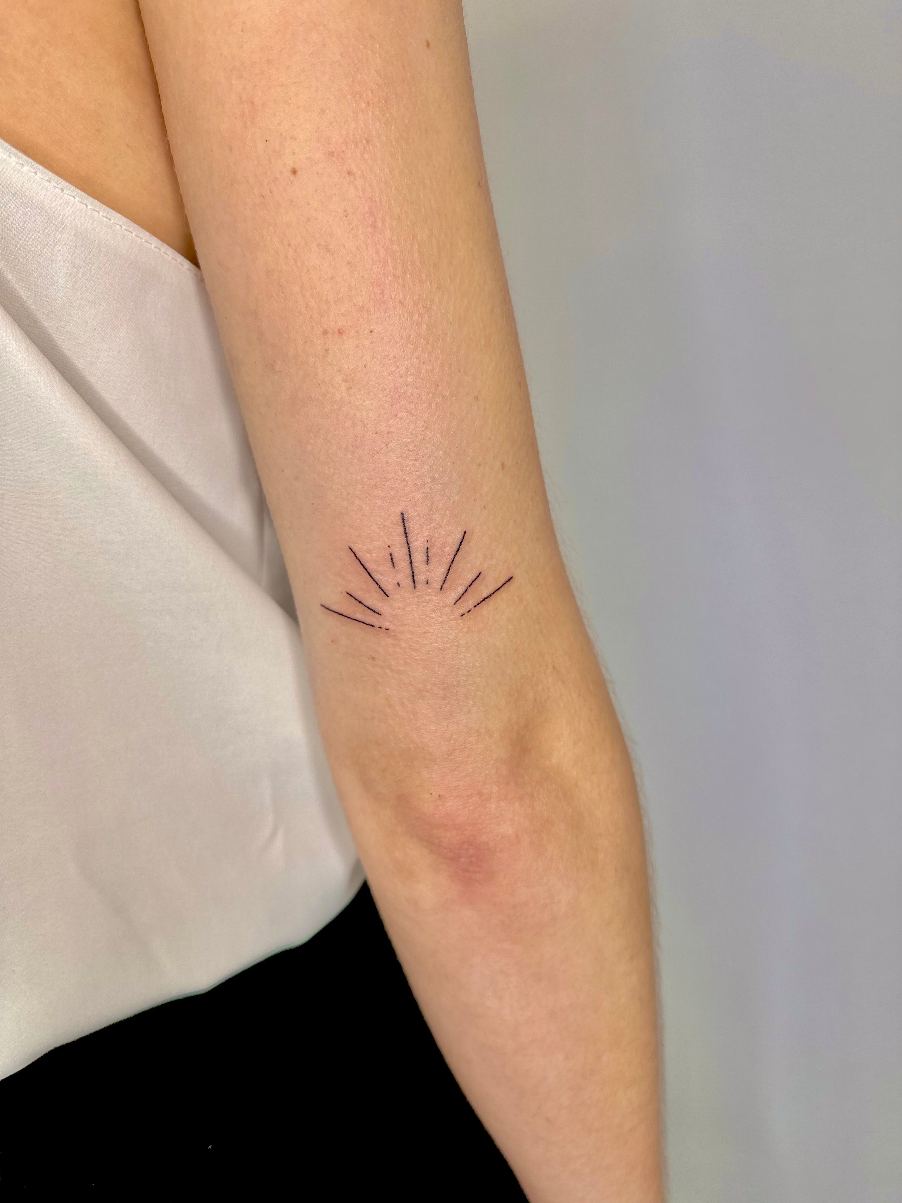 Delicate Sun Fine Line Tattoo • Tattoodo