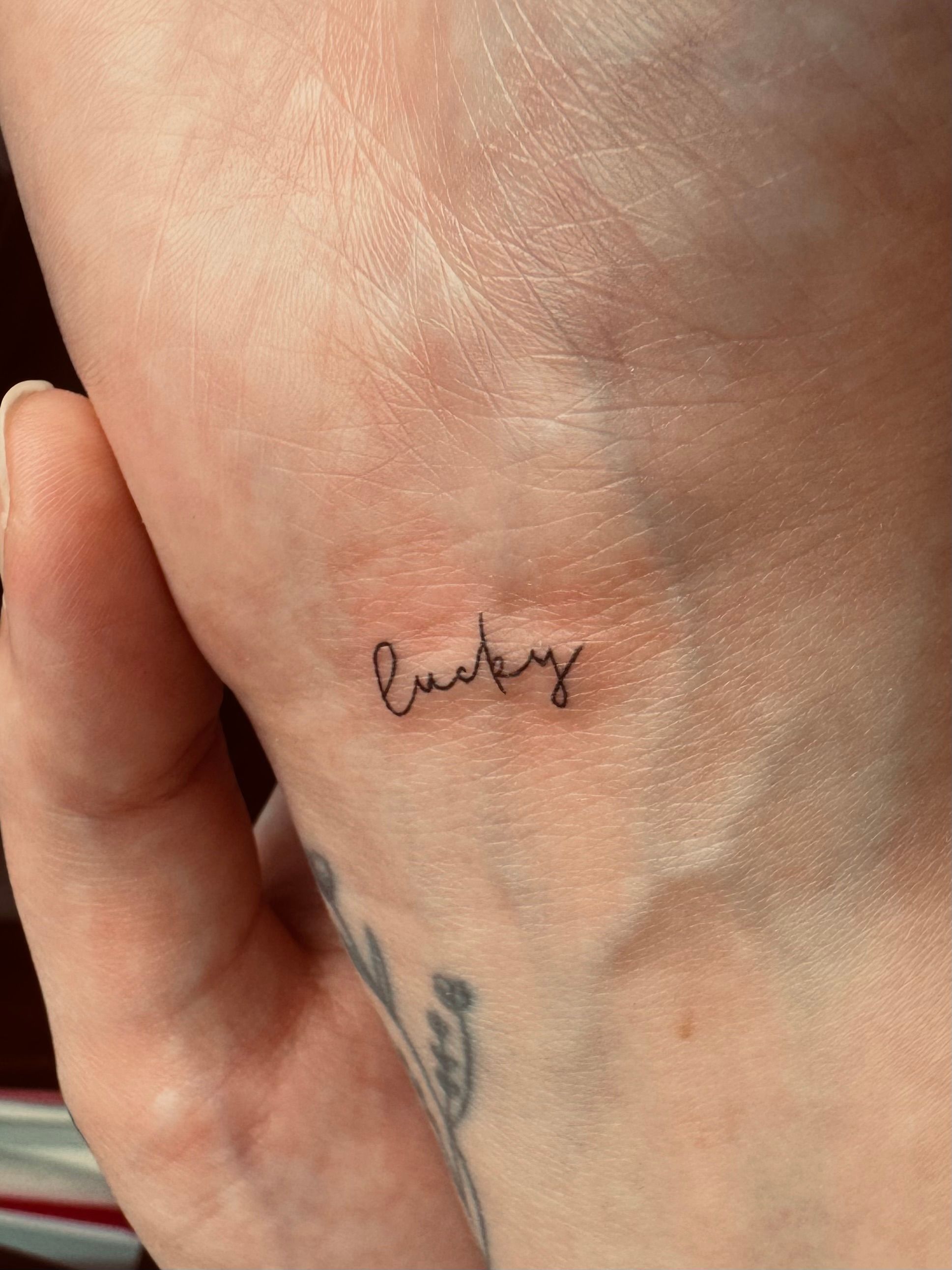 Elegant small lettering tattoo by Katerina Nireta • Tattoodo