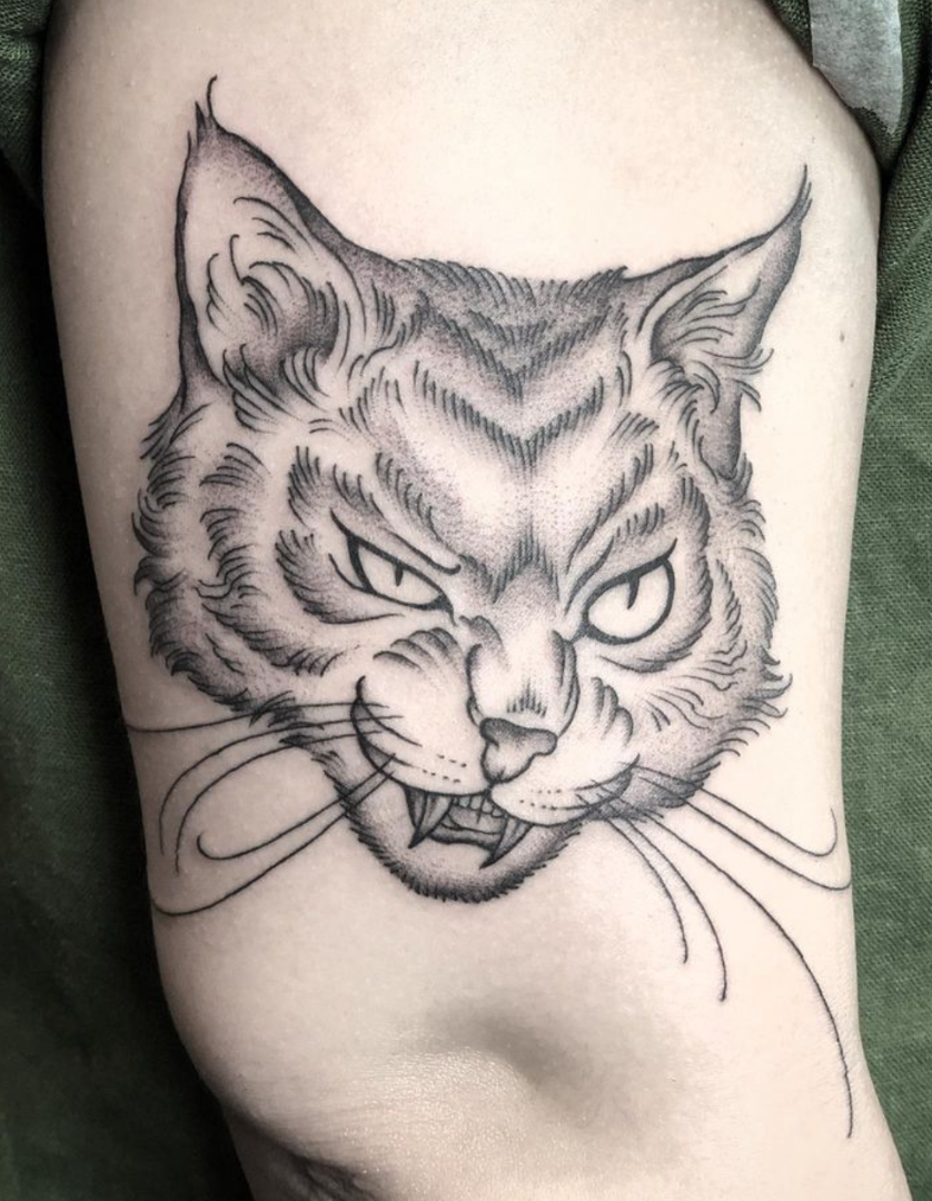 Menacing Cat Tattoo • Tattoodo