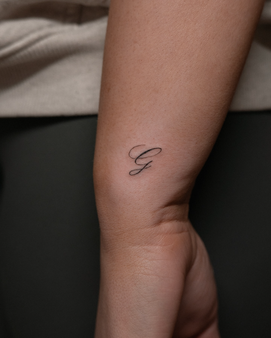 Cursive Letter G Tattoo
