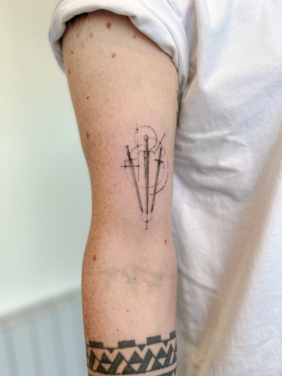 Fine Line Geometric Sword Tattoo • Tattoodo
