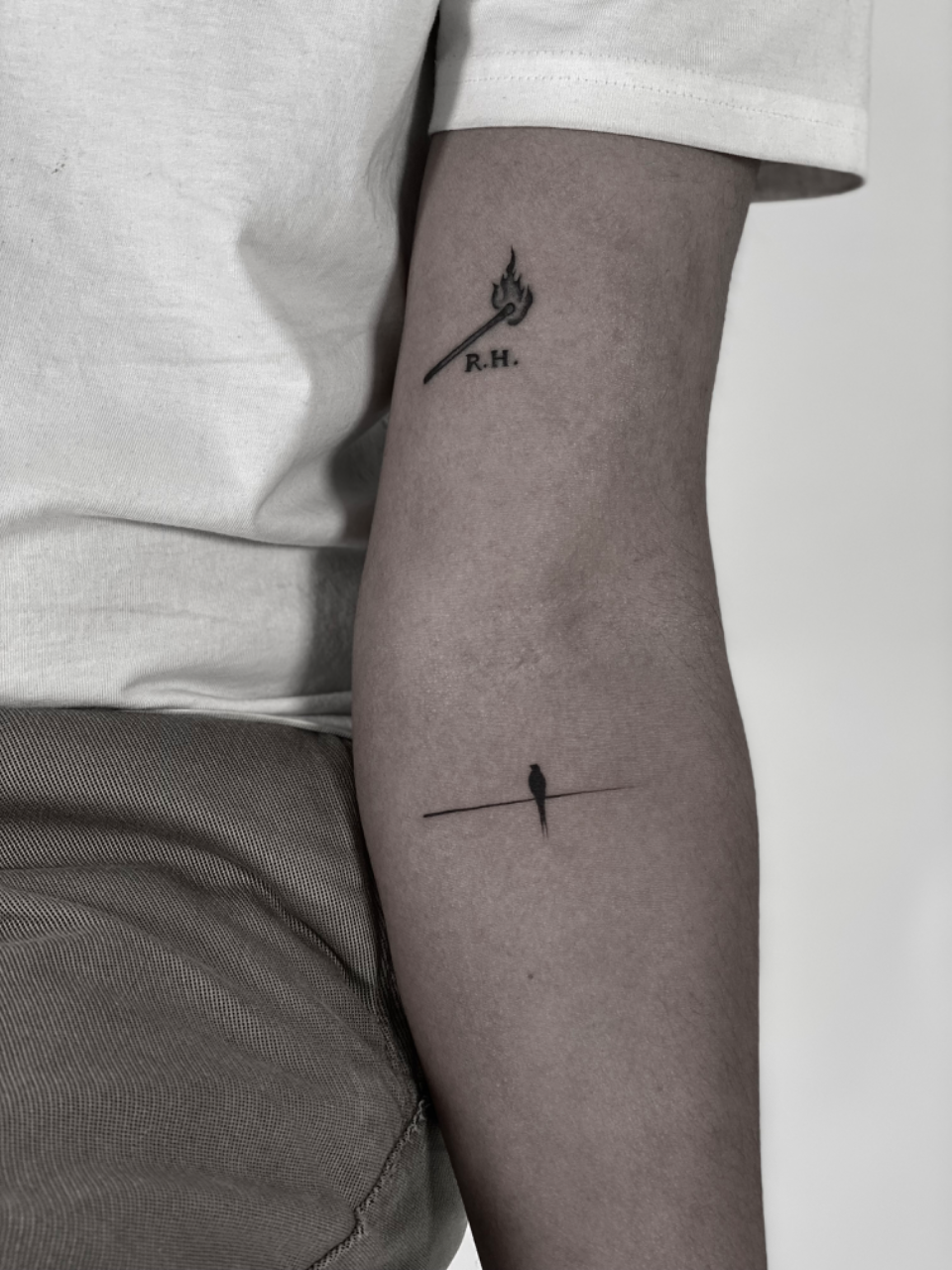 Minimalistic Bird and Matchstick Tattoo • Tattoodo