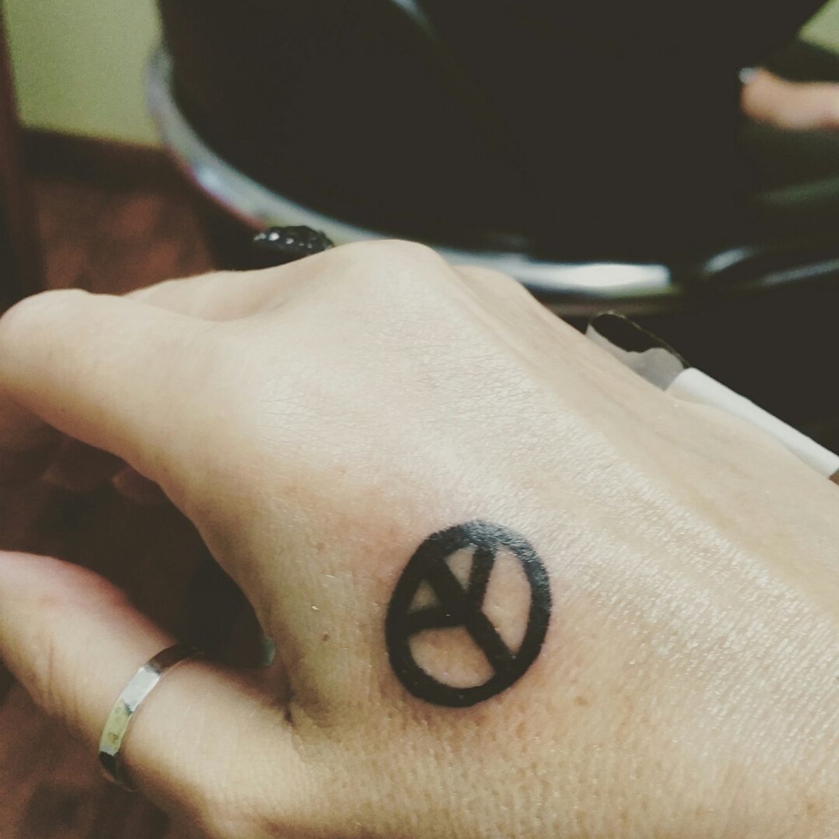 Tattoo uploaded by Laura Whiting • Small Peace Sign on Hand • Tattoodo