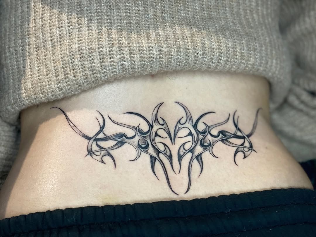 Feminine Tribal Lower Back Tattoos