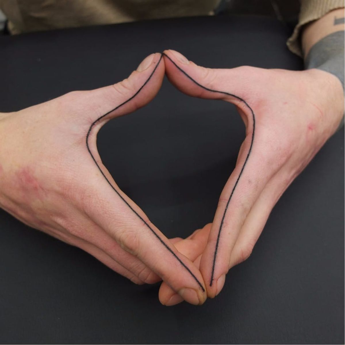 Tattoo uploaded by Xavier • Hand seam tattoo by Indy Voet. #line # ...